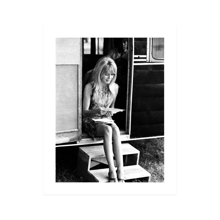 Globe Photos Entertainment Brigitte Bardot Reading Paper While Sitting ...