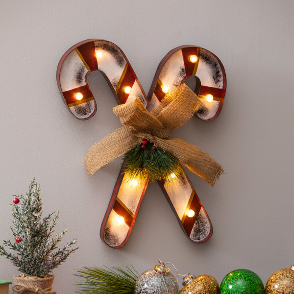 The Holiday Aisle® 20" H x 18" L Metal LED Candy Canes Wall Decor | Wayfair