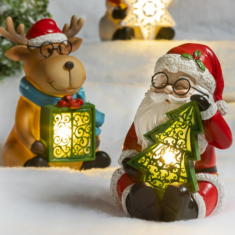 The Holiday Aisle® Jaxsten Holiday Santa Garden Statue with LED Tree ...