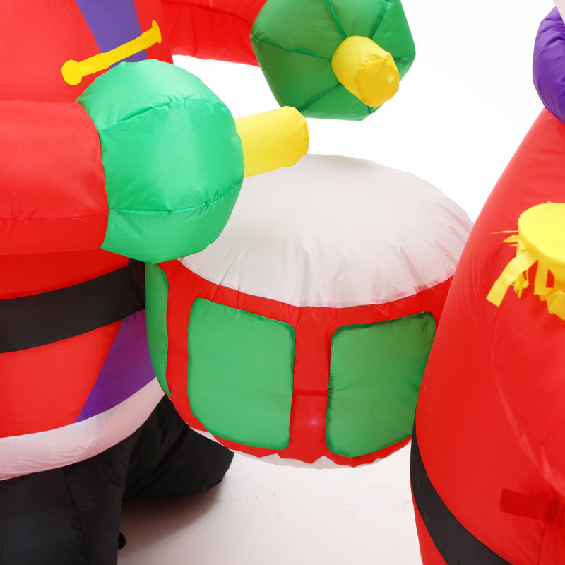 The Holiday Aisle® 8.2 Ft Long Toy Soldier Snowman Trio Inflatable with ...