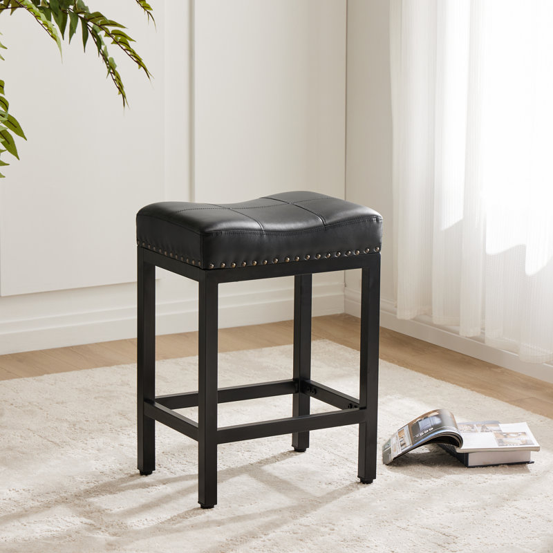 Winston Porter Michille Saddle Upholstered 24.21" Counter Stool ...