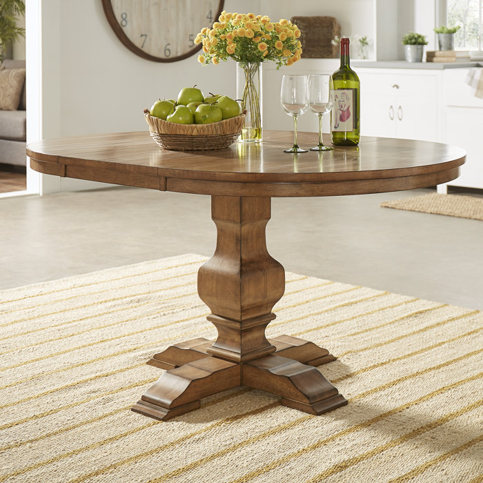 Three Posts™ Fortville Extendable Oval Solid Wood Dining Table ...
