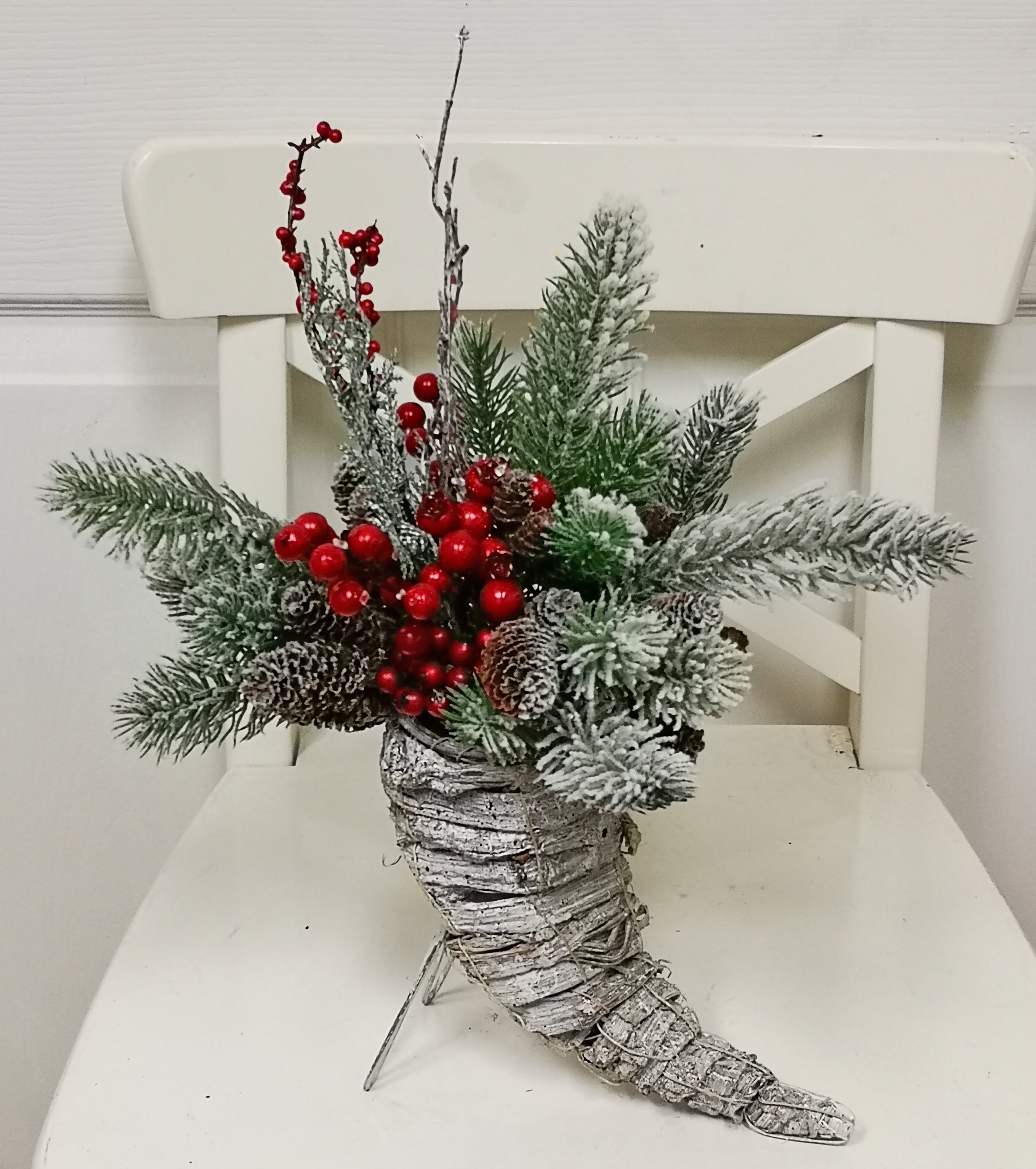 The Holiday Aisle® Berry and Pine Floral Arrangement in Basket | Wayfair