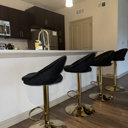 Everly Quinn Kshaun Swivel Upholstered Adjustable Height Counter Stool ...