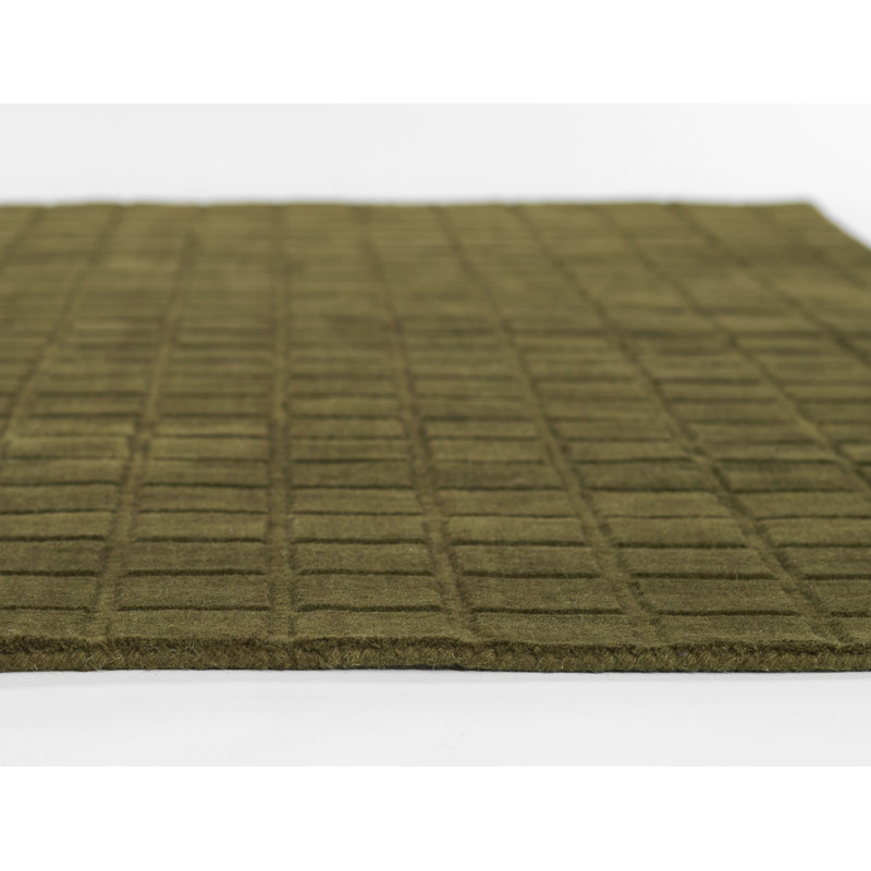 green geometric pattern rug