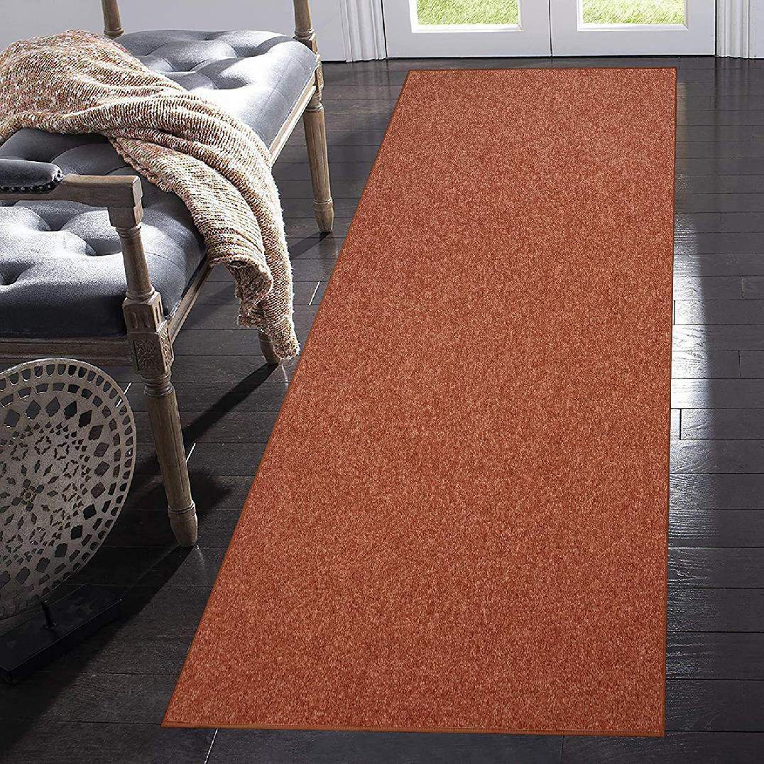 Latitude Run® Solid Color Machine Woven Polyester Area Rug in Rust ...