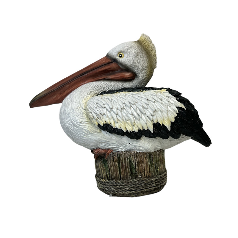 Highland Dunes Polyresin White & Black Pelican on Post Coastal Beach ...