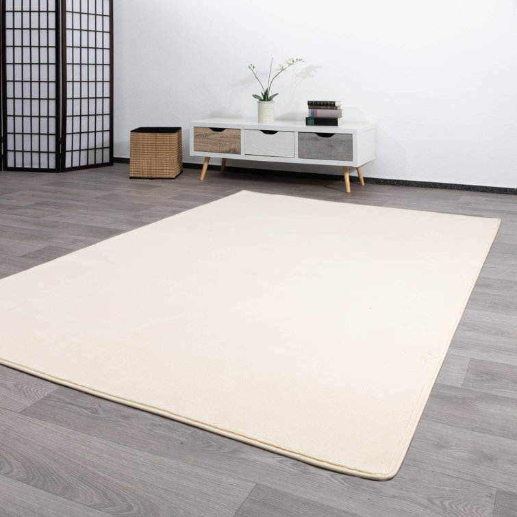 Ebern Designs Ilcho Solid Colour Machine Woven Machine Tufted Area Rug ...