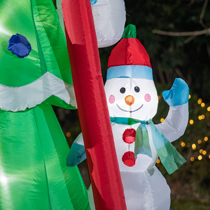 The Holiday Aisle® Lighted Inflatable Xmas Snowman Climbing Up Tree ...