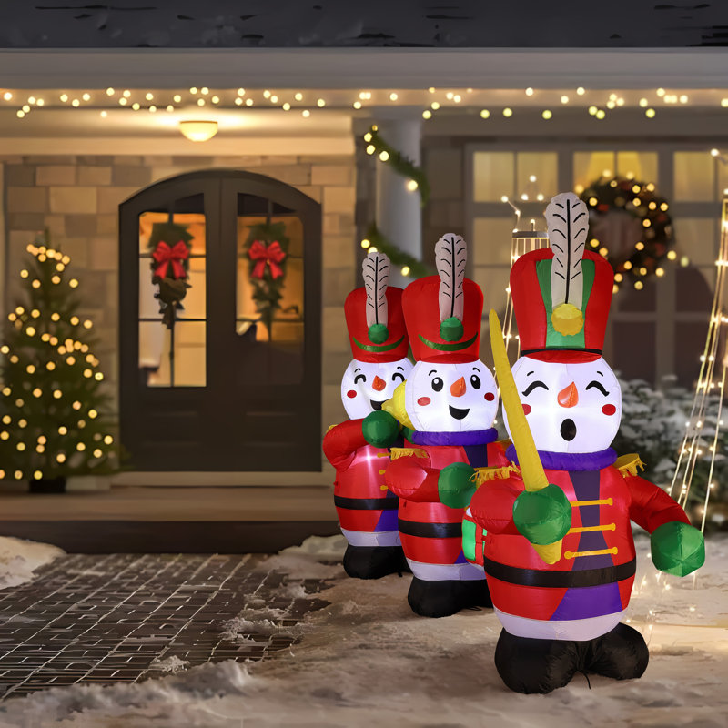 The Holiday Aisle® 8.2 Ft Long Toy Soldier Snowman Trio Inflatable with ...