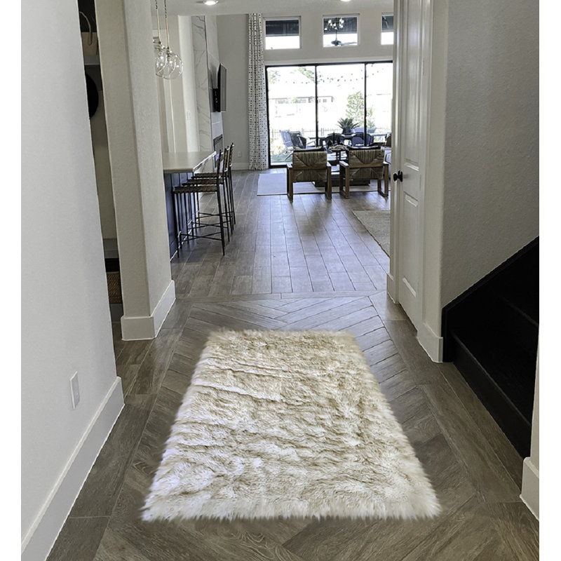 Everly Quinn Mar Vista Eternity Shag Faux Sheepskin Rug In White/Brown ...