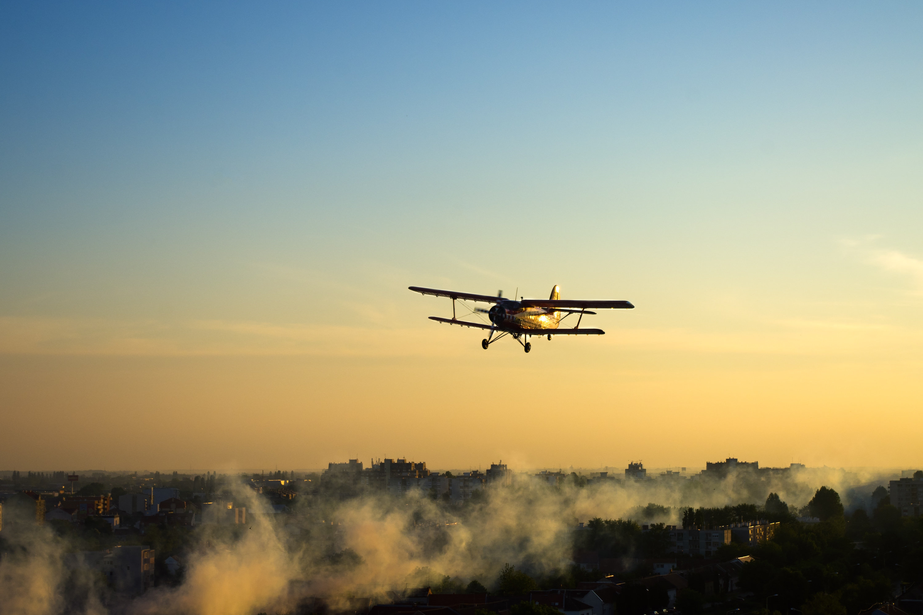 Ebern Designs Plane Spraying Mosquitoes over Town - Wrapped Canvas ...
