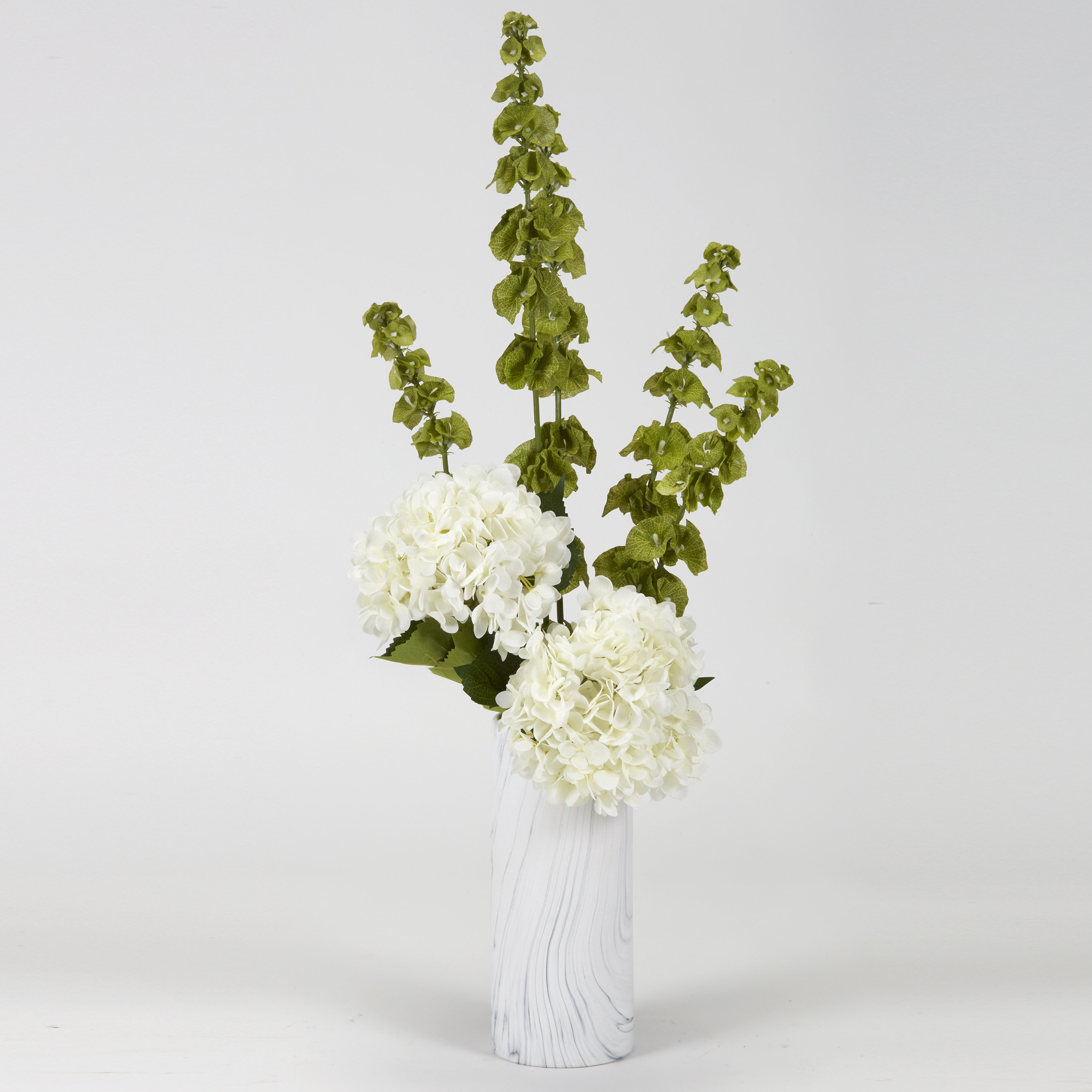 Primrue Hydrangeas And Bells Of Ireland In Marbled Ceramic Vase ...