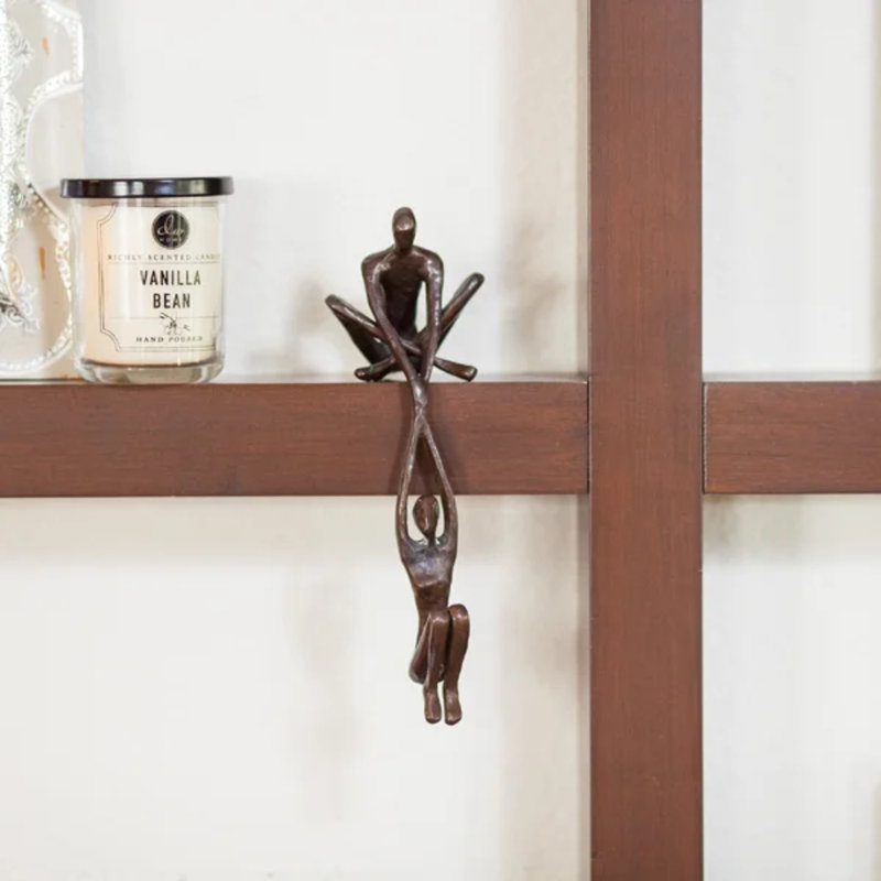 Wrought Studio™ Akyra Man Lifting Woman from Ledge Bronze Sculpture ...