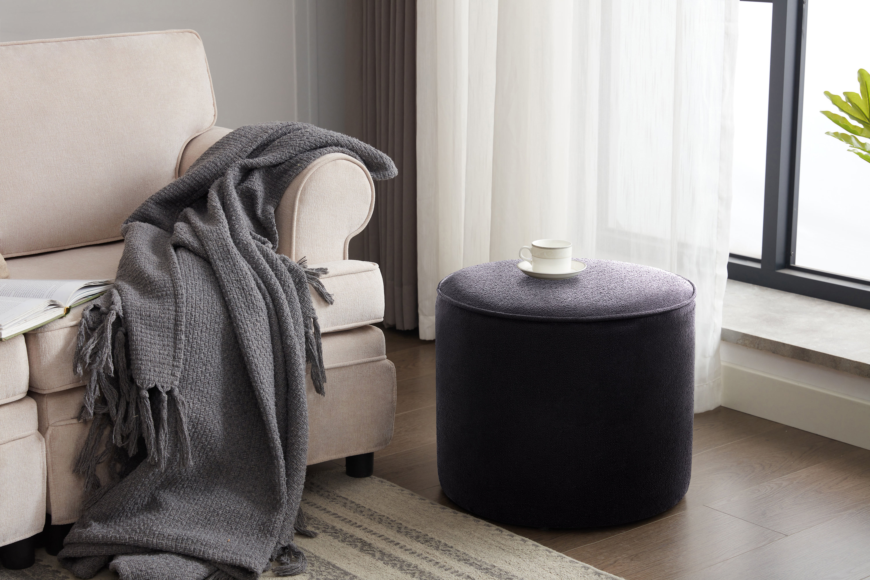 Ebern Designs Amarjot Bouclé Fabric Round Ottoman | Wayfair