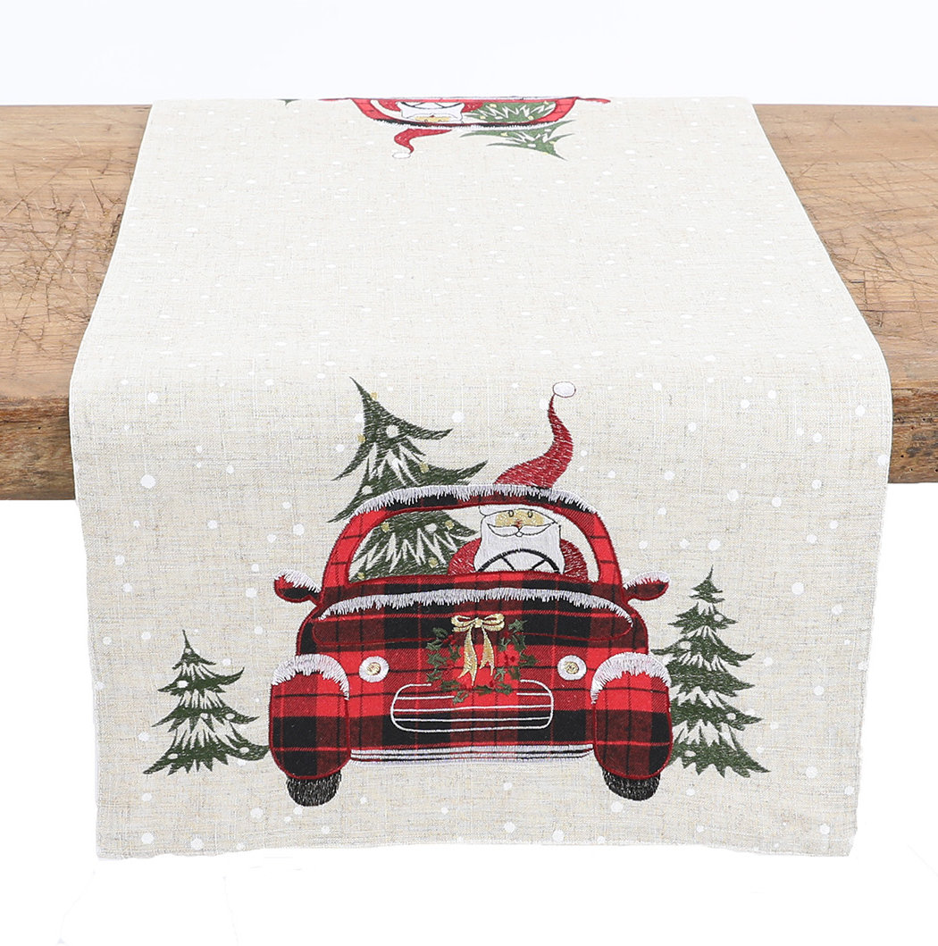 The Holiday Aisle® Imler Santa Claus Riding On Car Table Runner