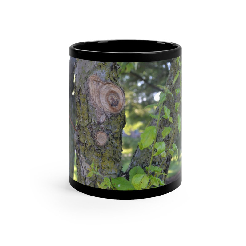 East Urban Home Tree Stump And Green Leaves 11Oz Black Mug | Wayfair