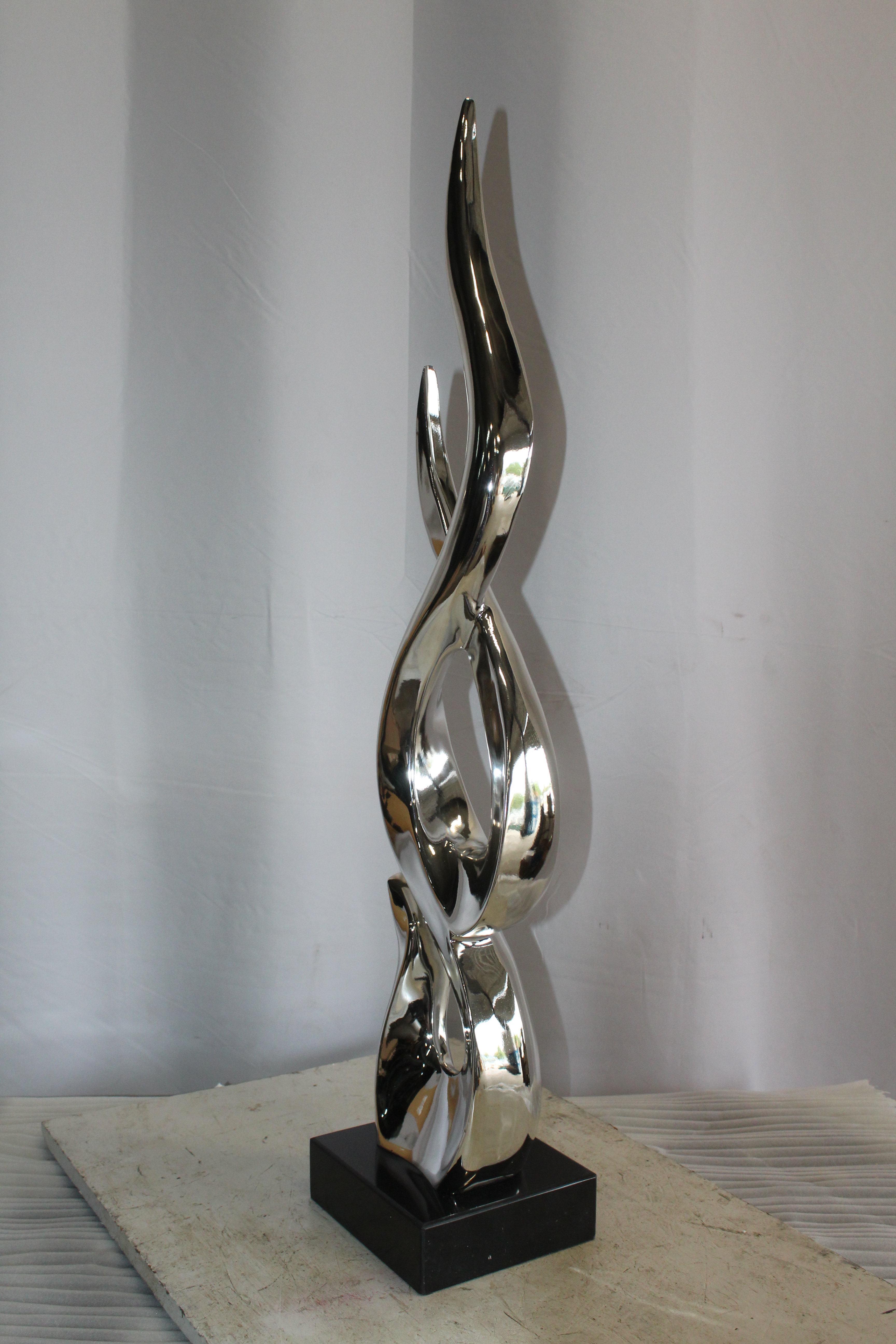 Nifao Collection Silver Abstract Intertwined Resin Statue on Marble ...