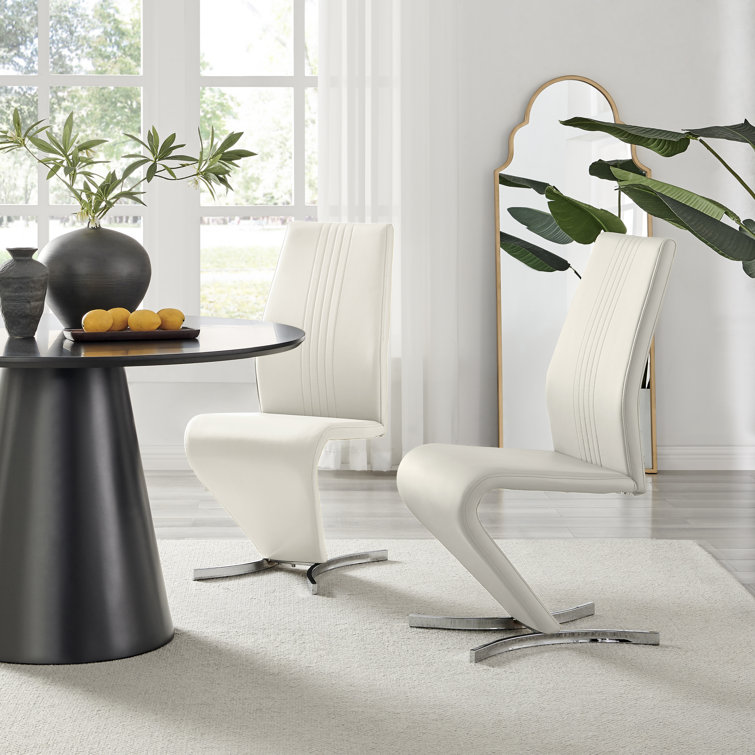 East Urban Home Wilhelm Faux Leather Chrome Feet 'Z' Leg Dining Chairs ...