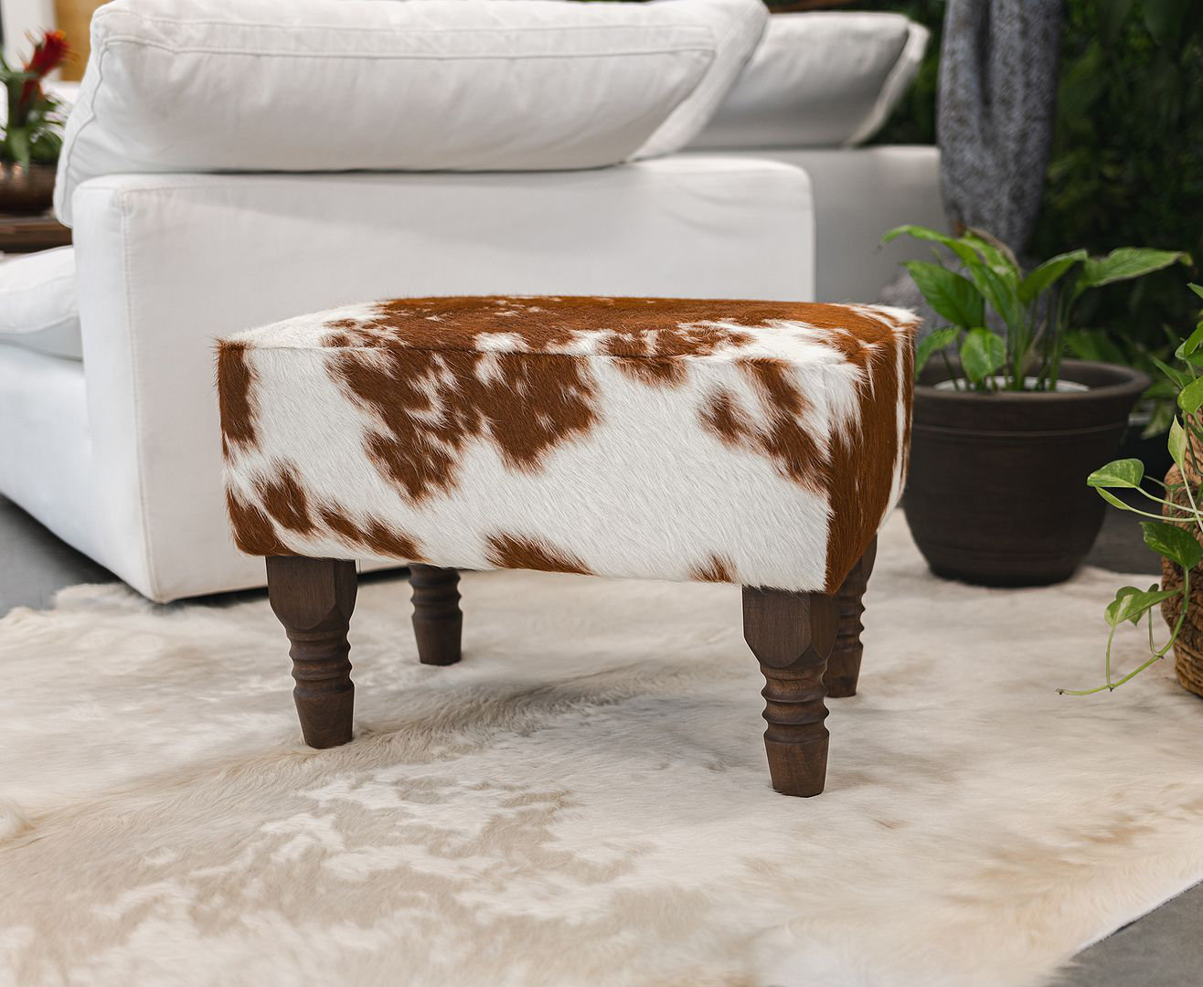 Loon Peak® Cowhide Ottoman Footstool With Wooden Legs | Wayfair